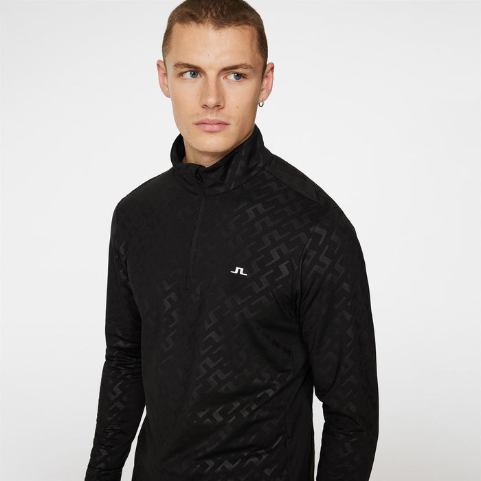 J.Lindeberg Luke Deboss Mid Layer Bias Bridge Black | TRENDYGOLF UK